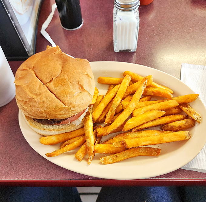 The burger-and-fries combo that launched a thousand road trips, perfectly executed with no unnecessary frills.