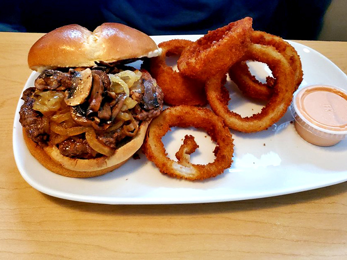 Mushrooms and onions sautéed to caramelized perfection. Those onion rings are the Olympic gold medalists of the fried food world.