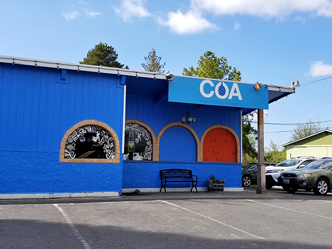 COA's vibrant blue exterior stands out like a delicious exclamation point, promising margaritas that make Tuesday feel like Friday.