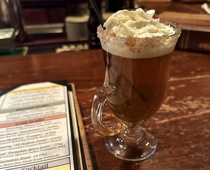 Winter in a glass: caramel apple hot cider topped with a cloud of whipped cream. Like drinking a cozy sweater on a chilly Delaware evening.