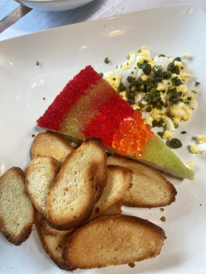 Caviar, egg, and toast points—the aristocrats of appetizers having a sophisticated get-together on fine china.