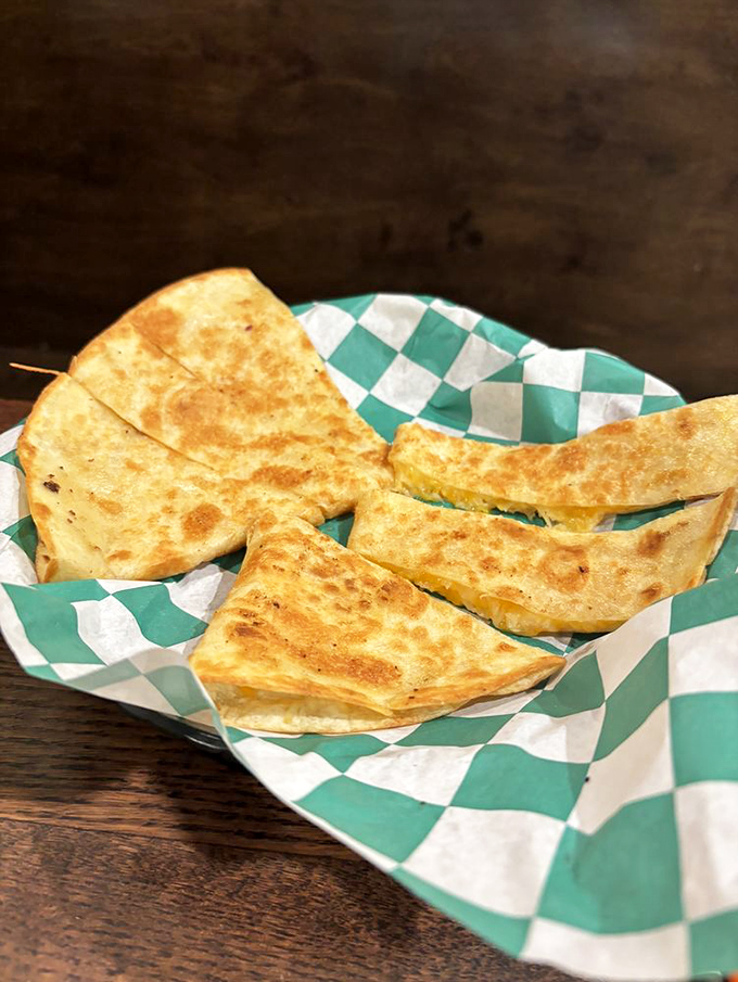 A quesadilla that's been kissed by the griddle gods &ndash; crispy on the outside, molten cheese paradise on the inside.