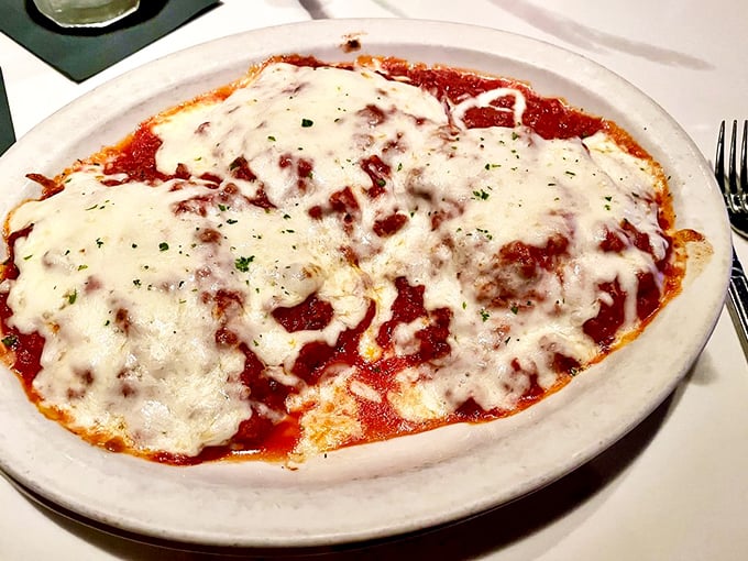 Cheese ravioli swimming in a sea of rich Bolognese. Each pillow of pasta holds a secret worth discovering.