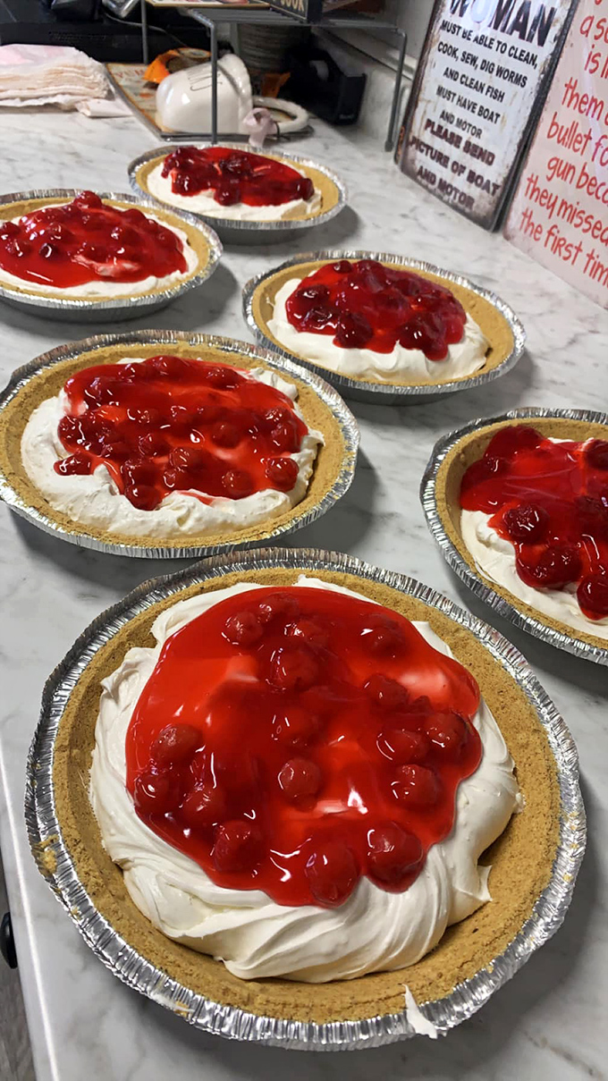 Cherry cheesecakes lined up like beauty contestants, each one vying for the title of "Most Likely to Make You Forget Your Diet."
