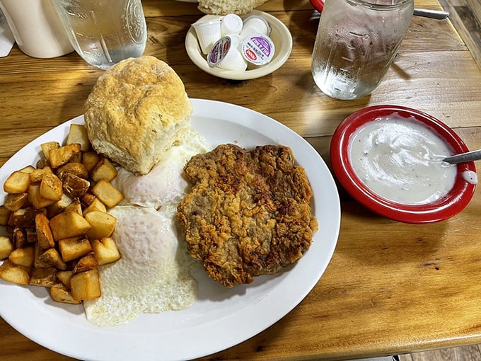 Chicken fried steak swimming in gravy with a homemade biscuit standing by—comfort food elevated to an art form without any fancy art school training.