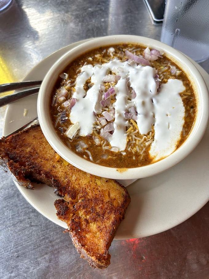 Chili that demands respect. With melty cheese rivers flowing across its spicy landscape, this bowl comes with grilled cheese for necessary dipping operations.