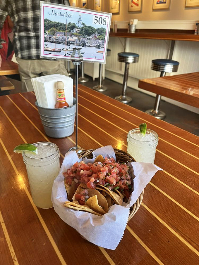 Two margaritas stand guard over chips and fresh pico de gallo&mdash;a setup that screams "your afternoon plans are officially canceled."