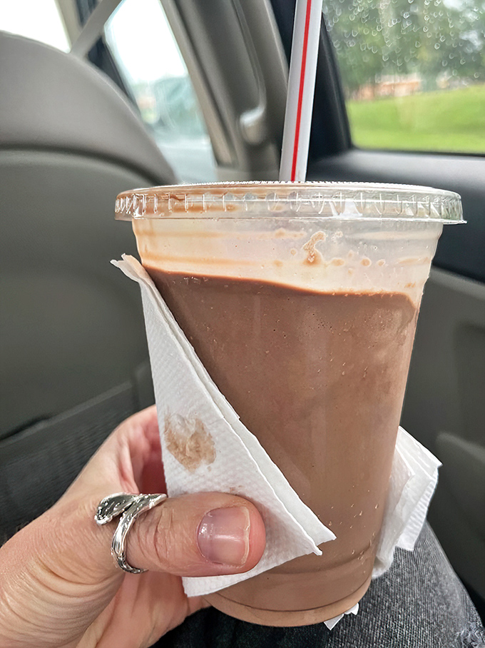 This chocolate milkshake isn't just traveling in a car&mdash;it's embarking on a journey to someone's moment of pure bliss.