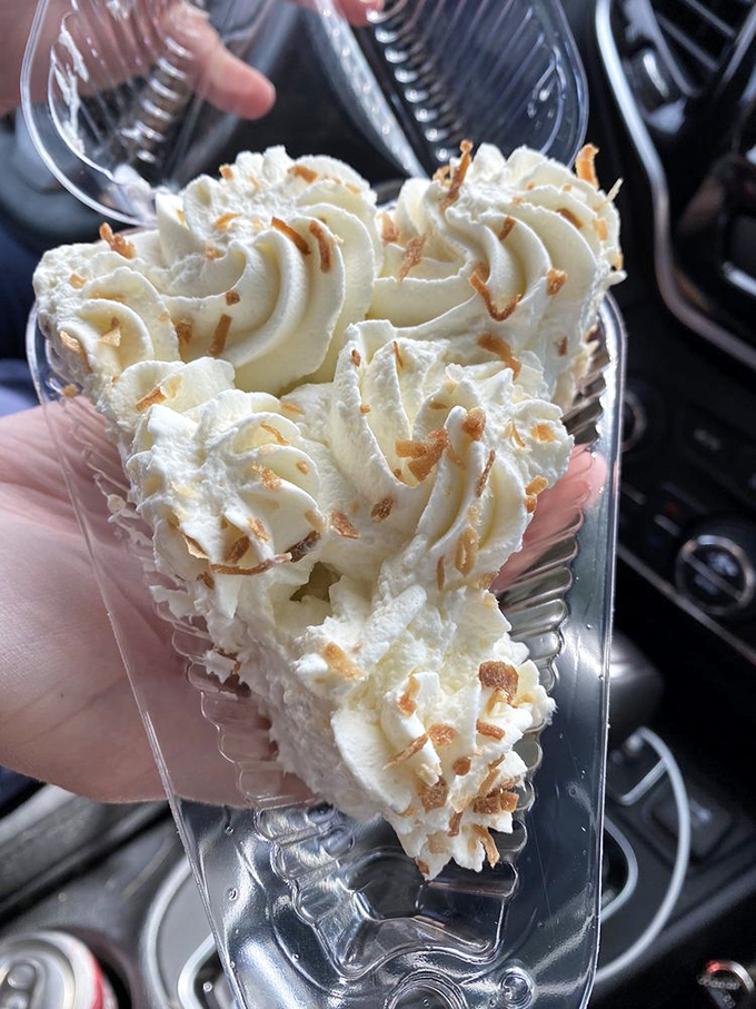 Coconut cream pie so light it might float away if not anchored by that buttery crust and toasted coconut topping.