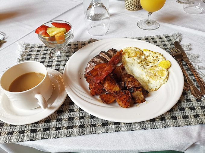 The breakfast spread speaks to simple pleasures done right: eggs cooked to perfection, savory meats, and coffee that demands multiple refills.