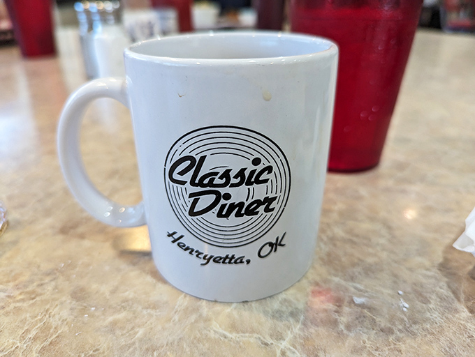The official chalice of diner devotees&mdash;a sturdy mug emblazoned with the Classic Diner logo, promising infinite refills and infinite possibilities.