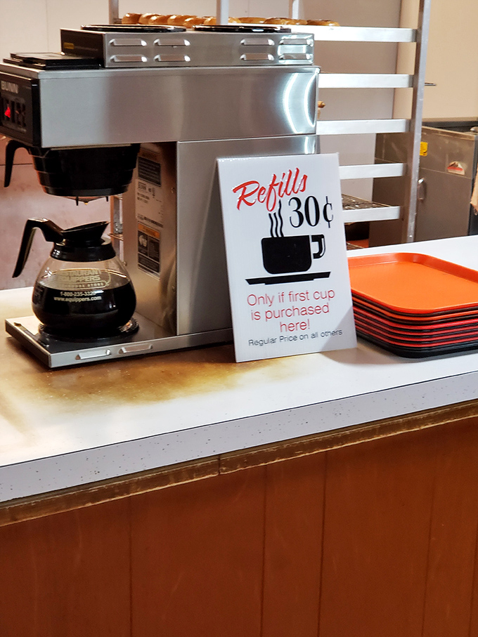 The coffee station offers 30-cent refills with a handwritten sign—a refreshing throwback to when customer loyalty was rewarded without apps or points.