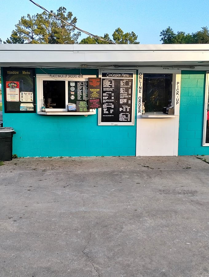 The concession stand's turquoise charm beckons with promises of buttery popcorn and ice-cold sodas&mdash;intermission's main attraction.