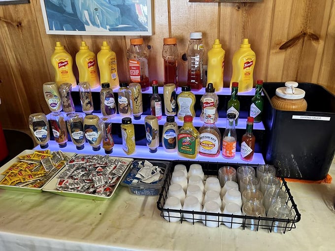 The condiment station stands ready like a painter's palette, offering the perfect tools to customize your masterpiece of meat and bread.