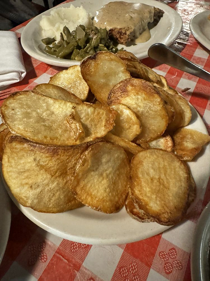 Cottage fries stacked like poker chips, except in this game, everyone at the table wins with each crispy, potato-y bite.