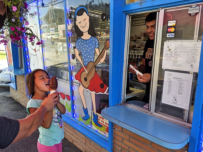 Service with a smile at the walk-up window&mdash;where childhood dreams are handed over one cone at a time.