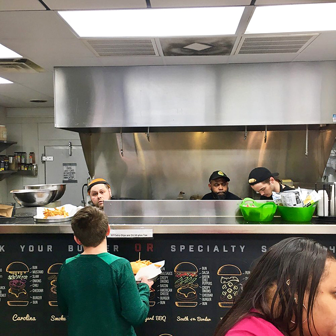 Where burger magic happens. The open kitchen design lets you witness your meal's journey from patty to masterpiece.