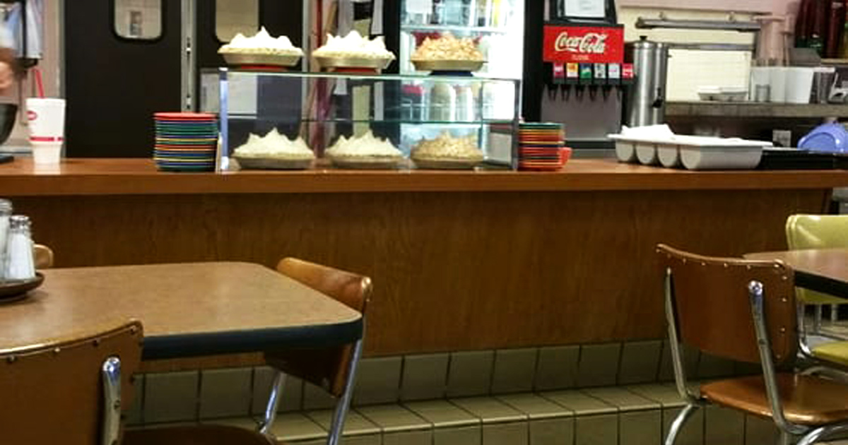 The counter view &ndash; where pies wait patiently in their display case, tempting you to save room for dessert before you've even ordered.