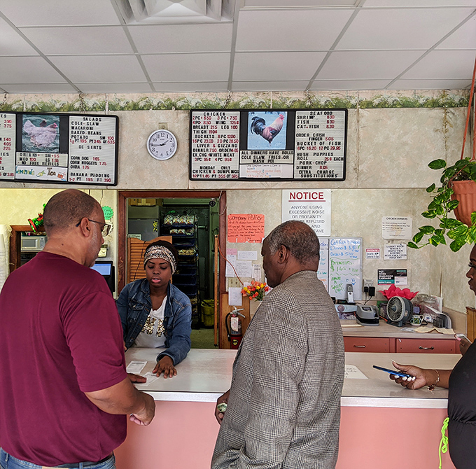 Behind this counter, magic happens daily. The menu boards above tell stories of countless satisfied appetites through the years.