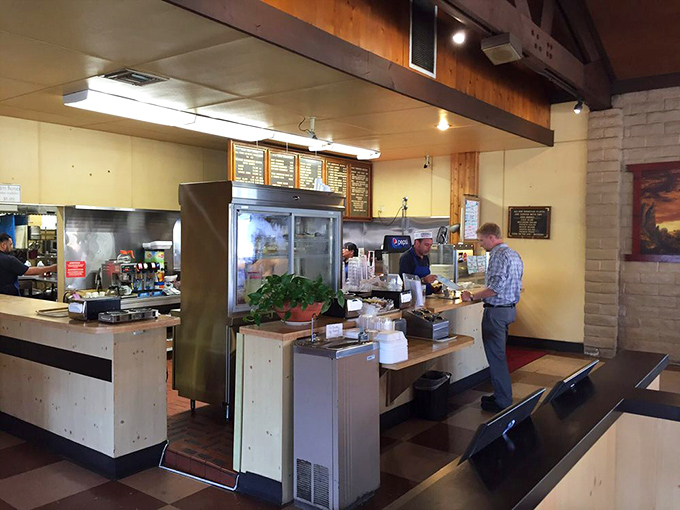 The counter where barbecue dreams become reality. Each tray that slides across this surface carries not just food, but moments of joy.
