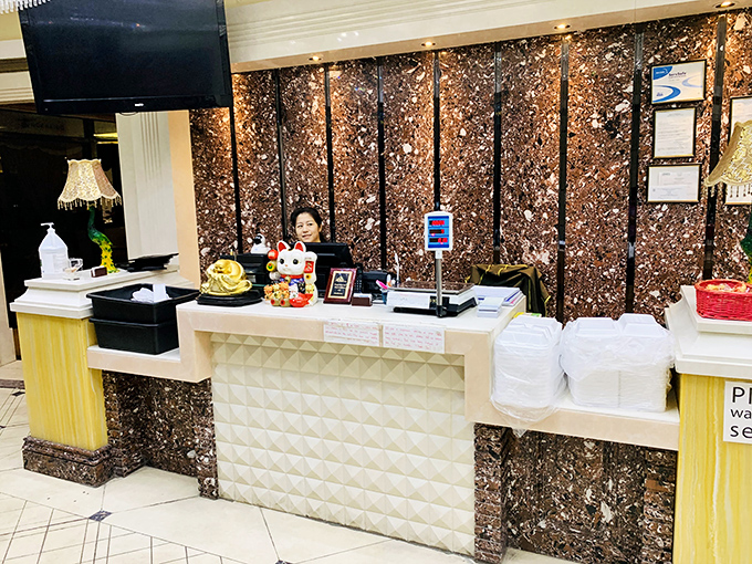 The welcoming front counter, complete with lucky cat figurine, where your all-you-can-eat adventure begins. The gateway to gluttony never looked so inviting.