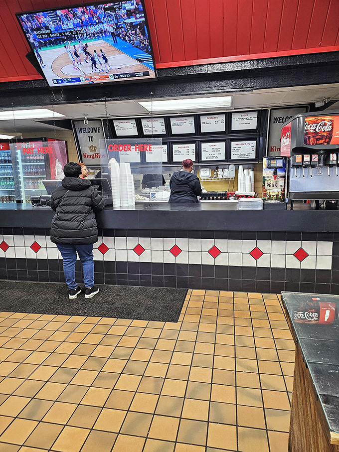 The moment of anticipation: standing at the counter, studying the menu like it's the Dead Sea Scrolls of smoked meat wisdom.