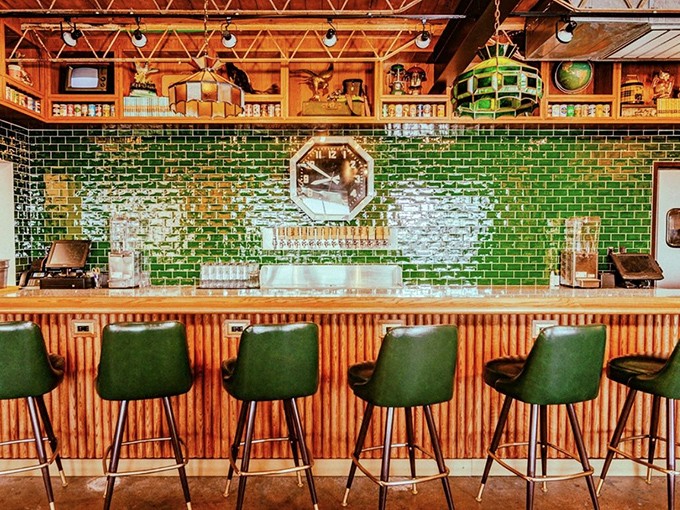 The emerald-tiled bar gleams like a jewel box for beer lovers. Those green barstools have witnessed countless "this is the best taco I've ever had" moments.
