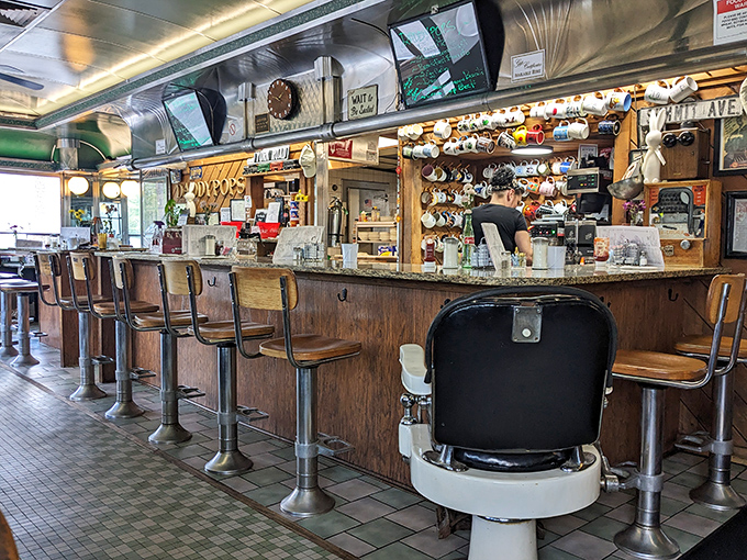 Counter seats that offer front-row tickets to the greatest show on earth: breakfast being made with decades of practiced precision.
