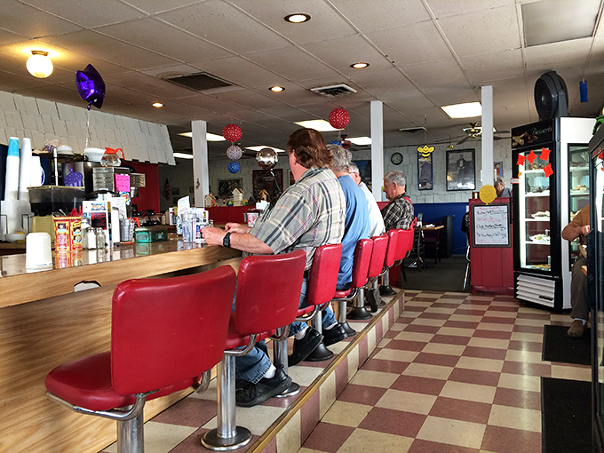 Counter seats: the front-row tickets to breakfast theater, where coffee refills appear before you even ask.