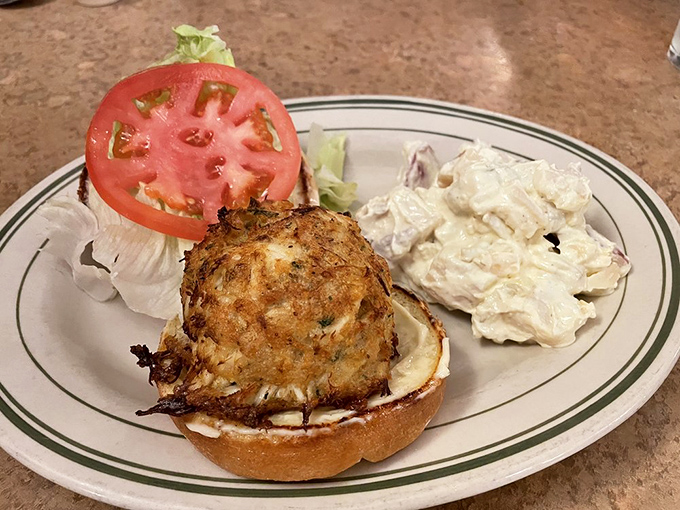 The perfect crab cake sandwich doesn't exi&mdash;wait, there it is, barely contained by the bun, ready to make lesser sandwiches question their life choices.