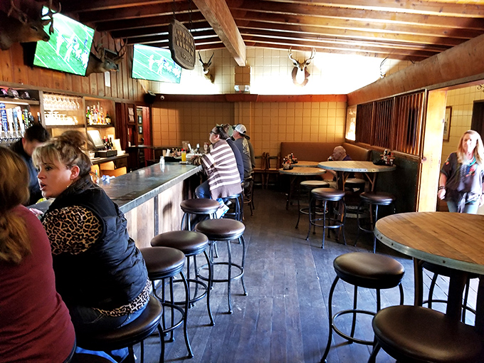 Where locals and pilgrims gather at the altar of oak-fired perfection. The mounted trophies on the wall have seen generations of satisfied smiles.