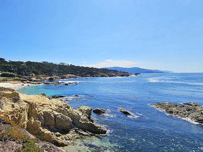 The coastline unfolds like nature's own IMAX experience, with rocky outcroppings playing supporting roles to the star of the show&mdash;that endless blue.