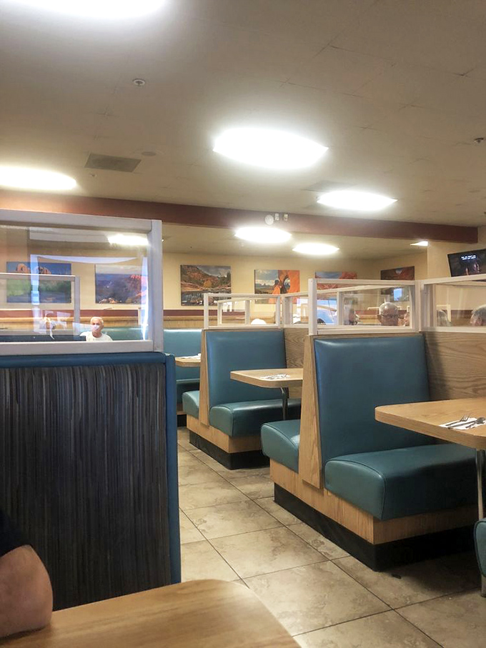 The dining area's turquoise booths and wood accents create that perfect sweet spot between "nice enough for a special occasion" and "comfortable enough for Tuesday lunch."