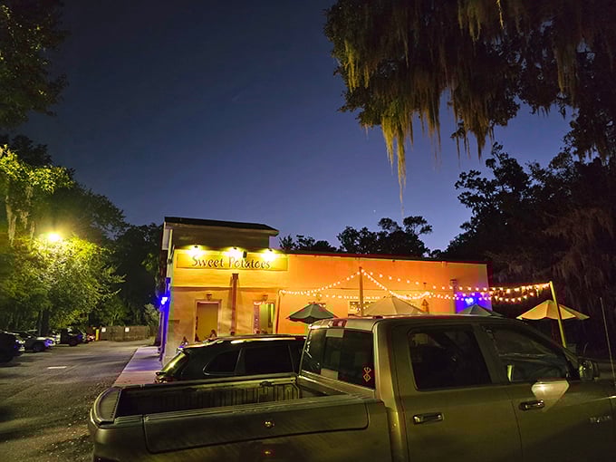 As evening falls, Sweet Potatoes Kitchen transforms into a beacon of culinary hope for hungry travelers. Those string lights aren't just decorative&mdash;they're guiding stars.