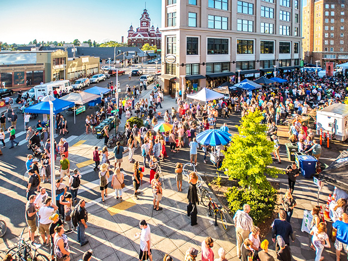 Community festivals transform downtown into the world's most affordable theme park, where the only admission fee is showing up.