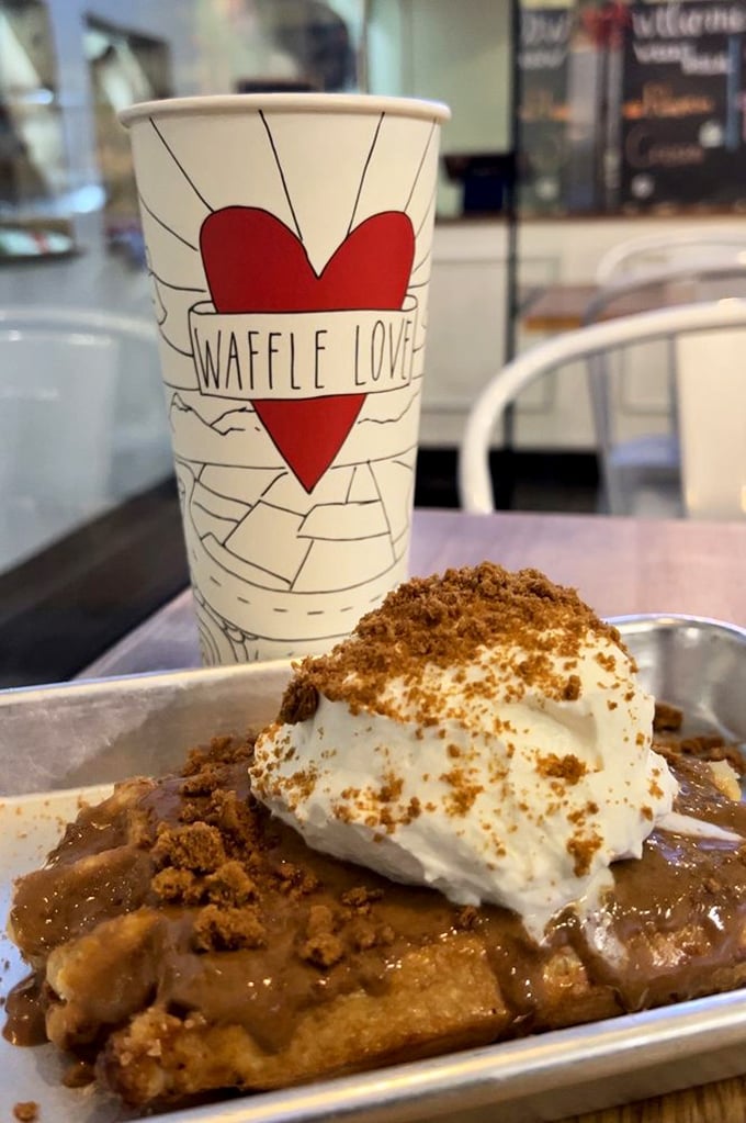 The Waffle Love cup stands guard over a cinnamon-dusted creation that's part breakfast, part dessert, and entirely worth the calories.