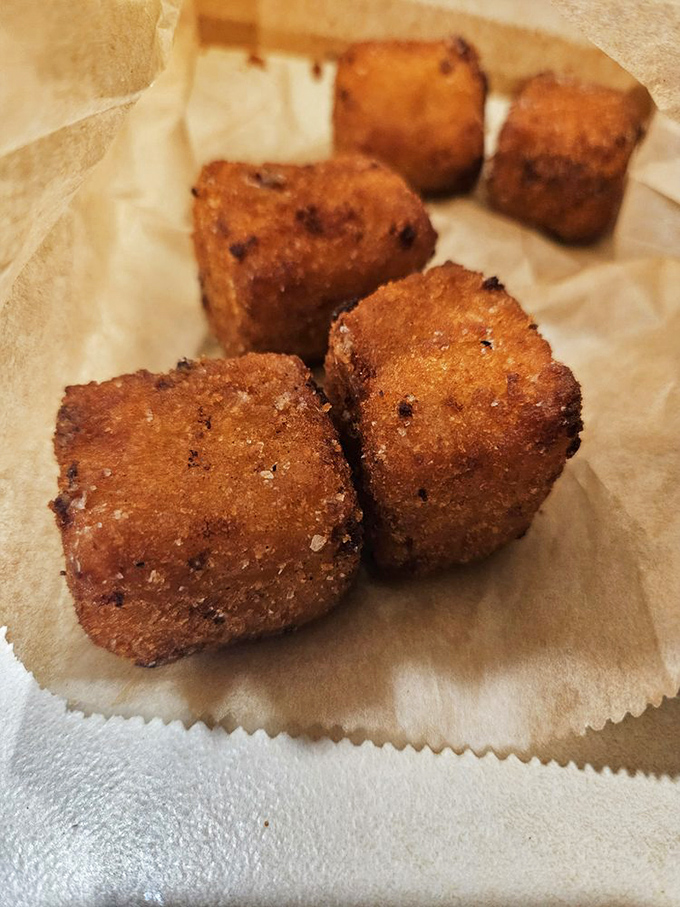 These golden cubes of fried mac and cheese are what would happen if comfort food went to finishing school and came back with an attitude. 