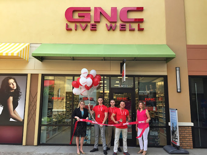 GNC's grand opening brings ribbon-cutting excitement to the outlets—because hunting for deals requires stamina, and stamina requires supplements!