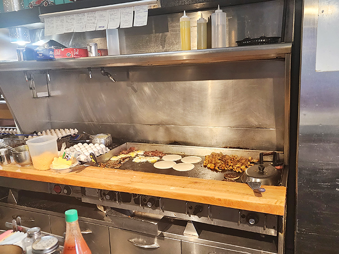 Where the magic happens &ndash; a well-seasoned flat-top that's seen more eggs than most chicken farms and knows exactly how to treat them.