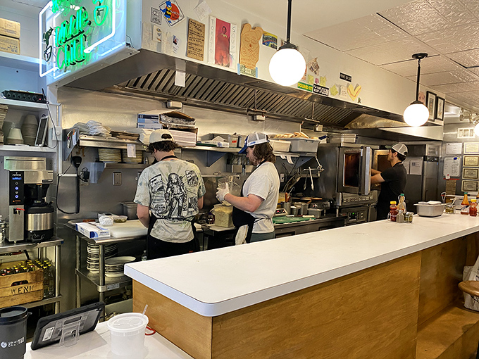 The open kitchen design lets you witness the choreography of sandwich artisans at work, turning simple ingredients into edible masterpieces.