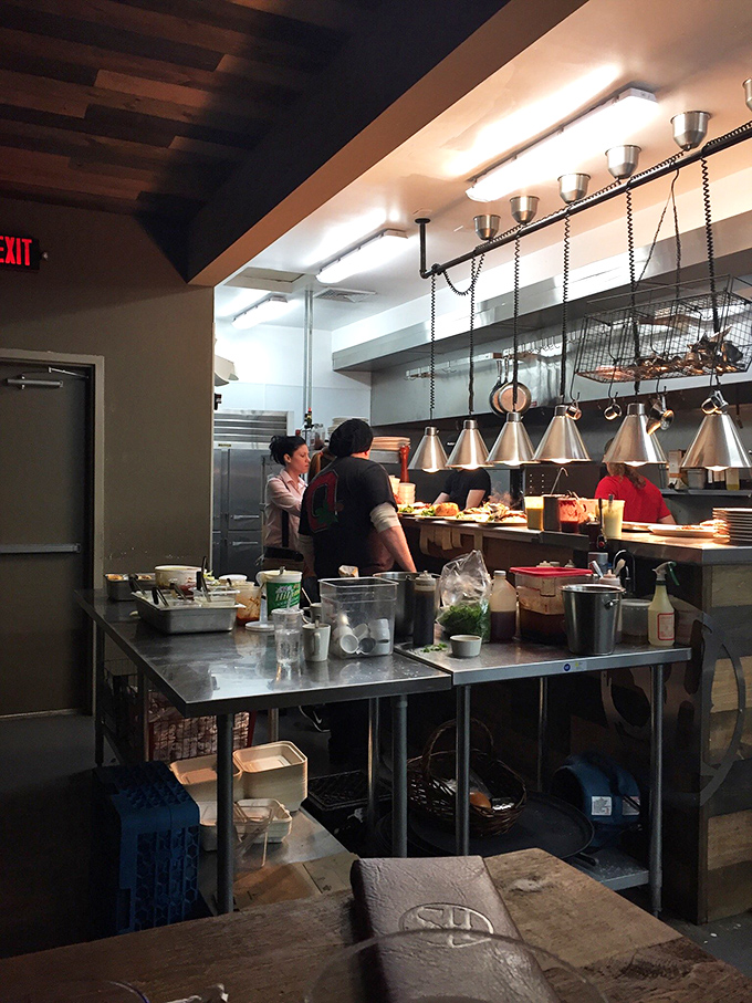 A glimpse into the kitchen reveals the orchestrated chaos where culinary magic happens&mdash;like watching the backstage of a Broadway show, but with better snacks.