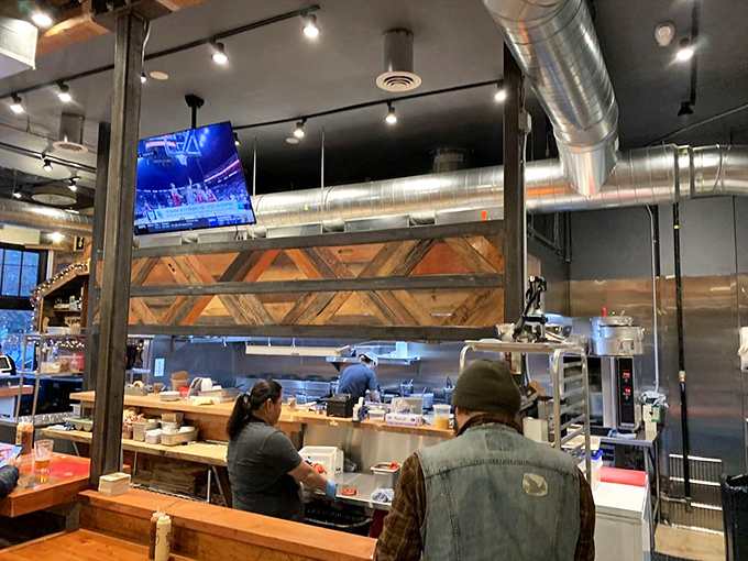 Where the magic happens: an open kitchen that has nothing to hide. Transparency tastes good when you're doing it right. 