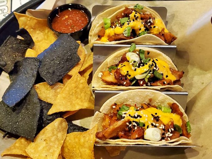 These Korean chicken tacos bring East meets Midwest in soft tortilla hugs. The black and yellow chips are like fashionable accessories for your meal.