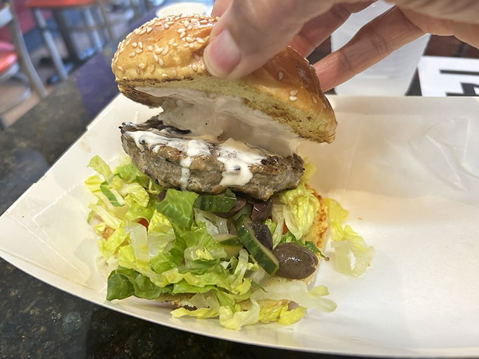 This lamb burger with tzatziki might make you forget beef exists. Greece's gift to the burger world deserves a standing ovation.