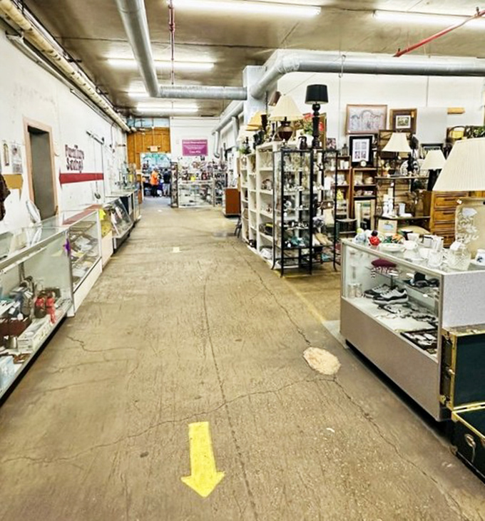 High ceilings and industrial charm create the perfect backdrop for furniture shopping that feels more like archaeological exploration.