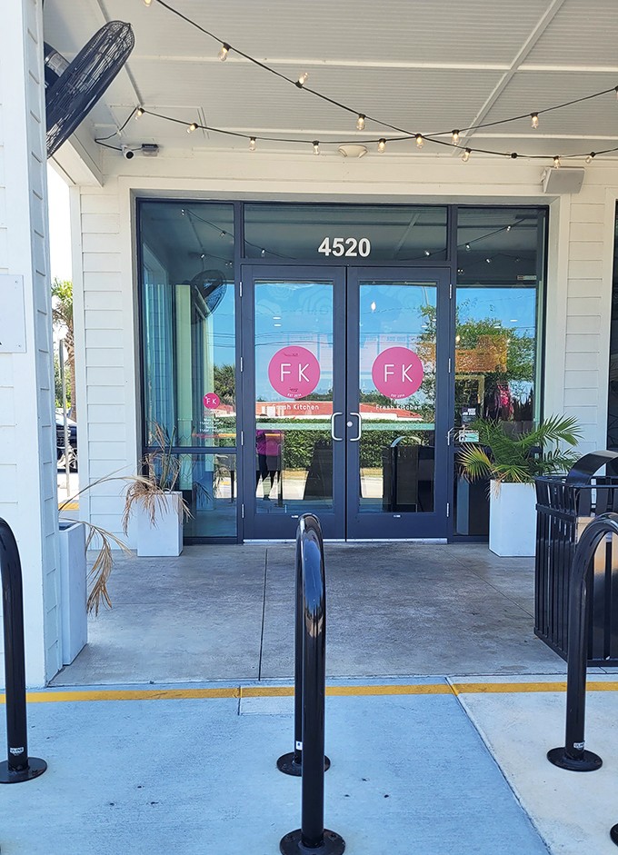 String lights and clean lines welcome you to Fresh Kitchen's entrance, where healthy eating and Florida sunshine converge beautifully.