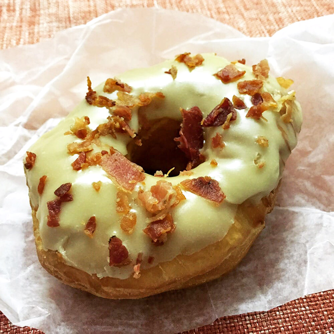 Pale green glaze sprinkled with bacon bits&mdash;a savory-sweet combination that makes your taste buds feel like they've won the lottery.