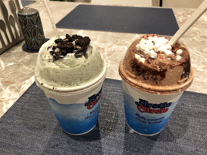 Mint and Oreo shakes standing tall like creamy skyscrapers, topped with cookie rubble that would make any dessert architect proud.