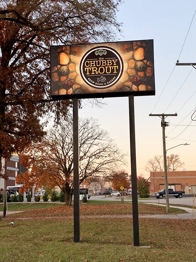 The roadside sign stands like a beacon for hungry travelers, promising rustic charm and seafood delights in the heart of the Midwest.