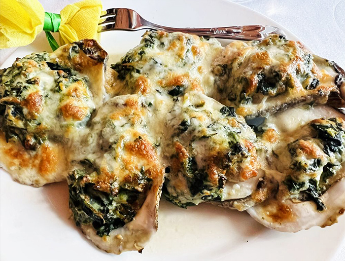 These Oysters Rockefeller wear their cheesy, spinach-laden topping like a decadent spa treatment. Seafood that's dressed for a night out. 